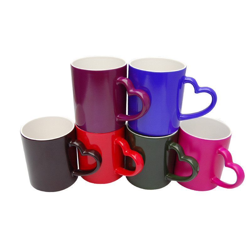 Magic mug with heart-shaped handle